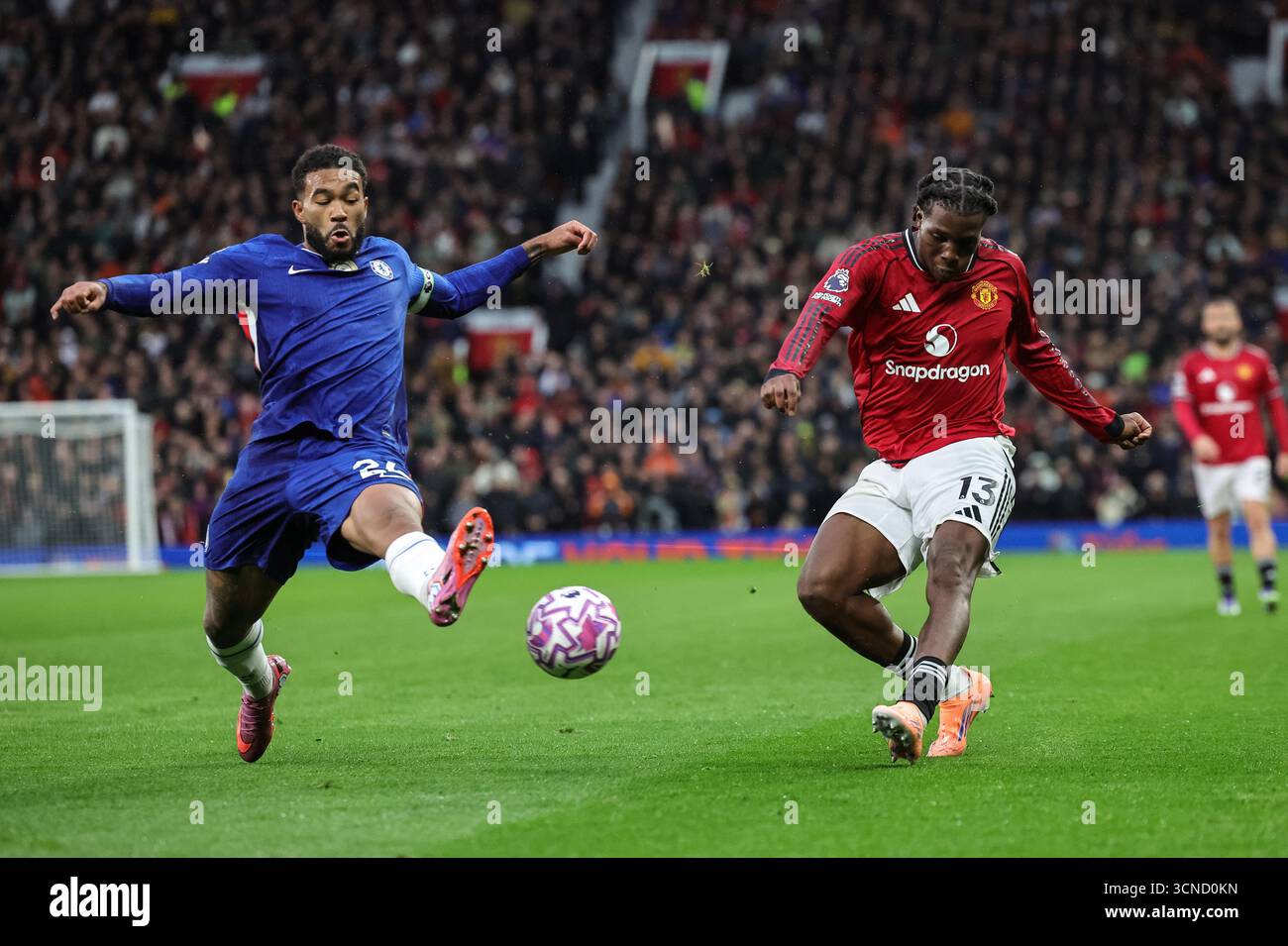 Reece James of Chelsea blocks a cross from Patrick Dorgu of Manchester ...