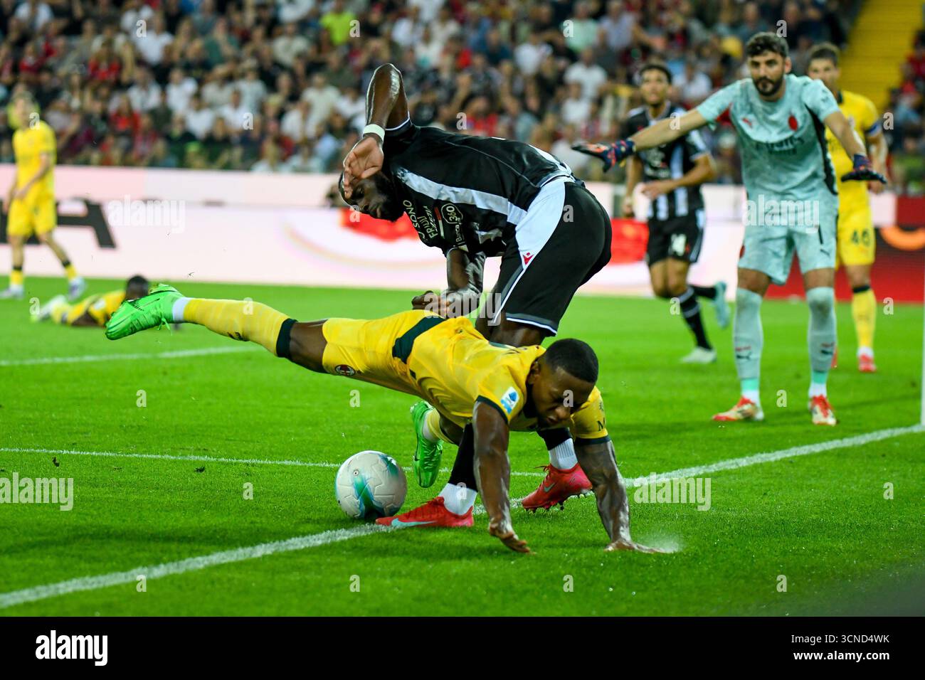 Milan's Pervis Estupinan in action against Udinese's Keinan Davis ...