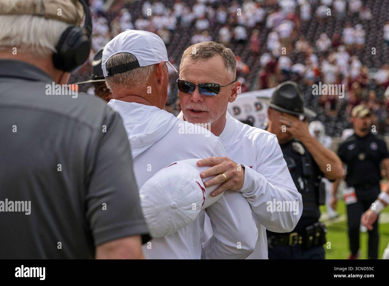 Virginia Tech head coach Philip Montgomery greets Wofford head coach ...