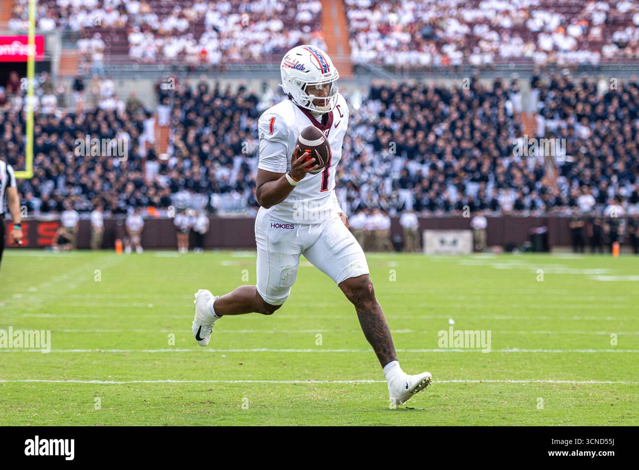 Virginia Tech quarterback Kyron Drones (1) runs the ball for a ...
