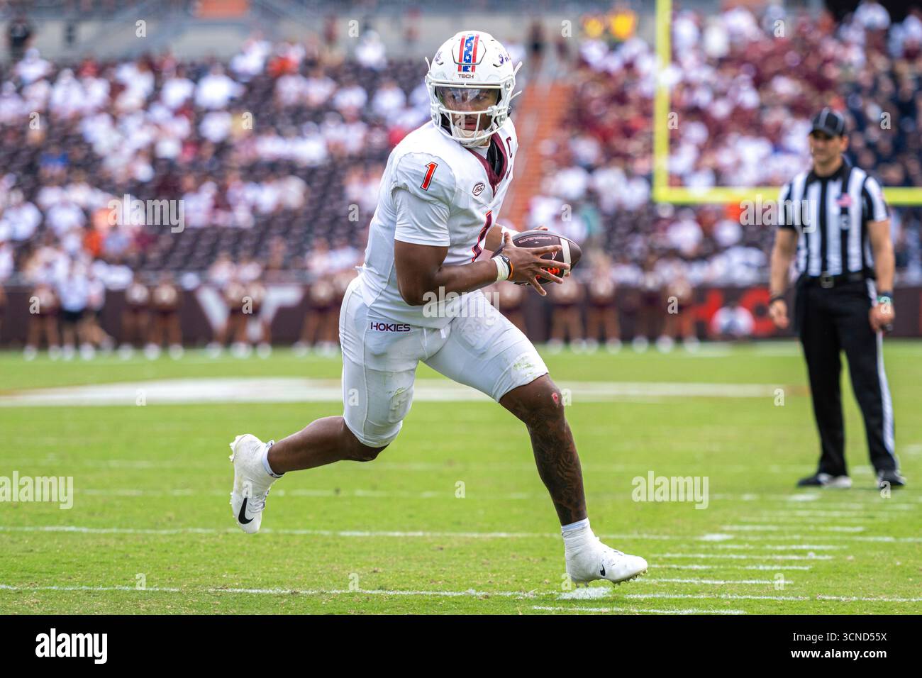Virginia Tech quarterback Kyron Drones (1) runs the ball for a ...