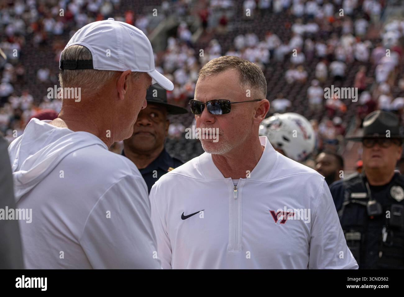 Virginia Tech head coach Philip Montgomery greets Wofford head coach ...