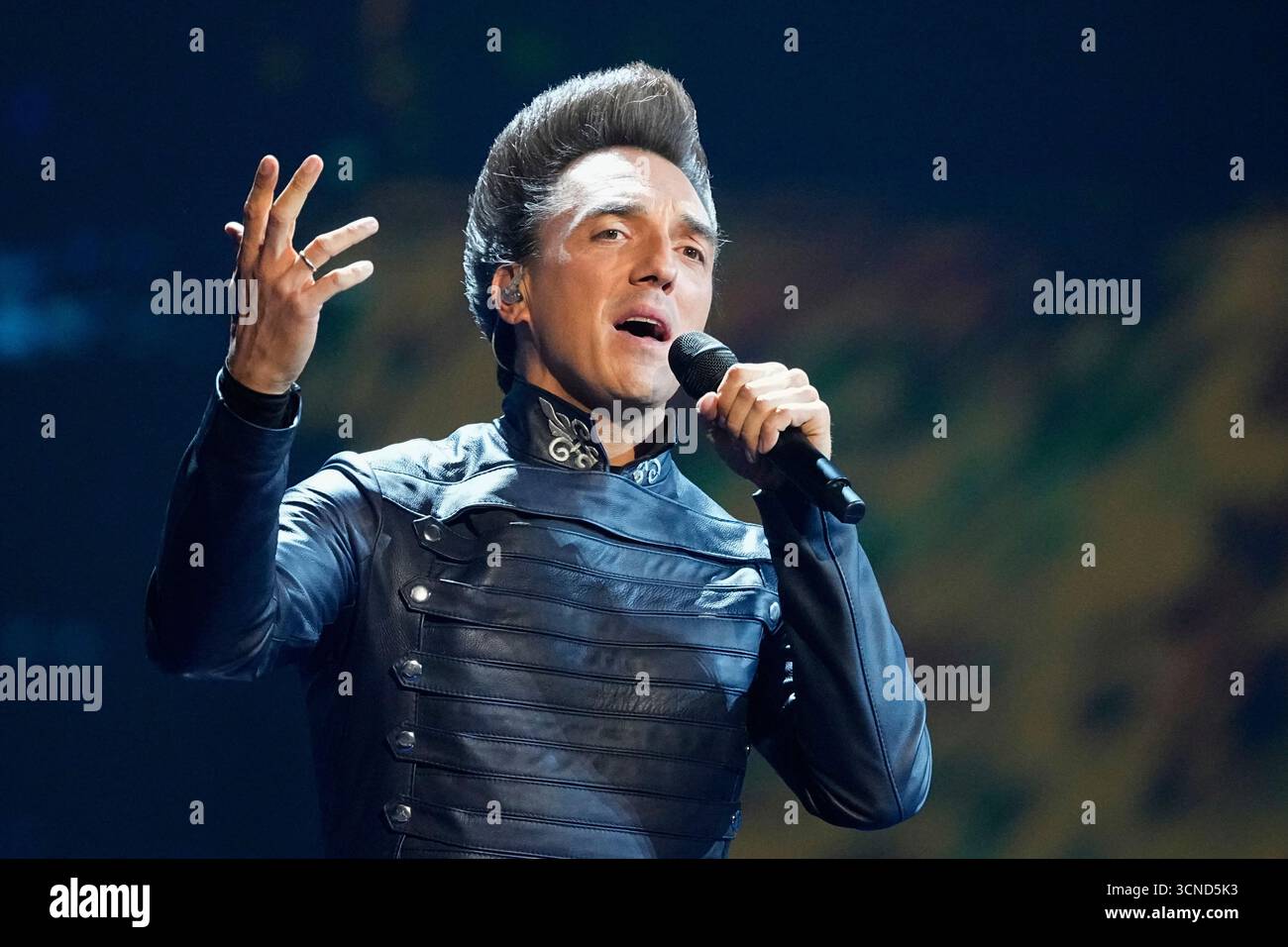 Serbia's Slobodan Trkulja performs the song "Three Little Roses" at the ...