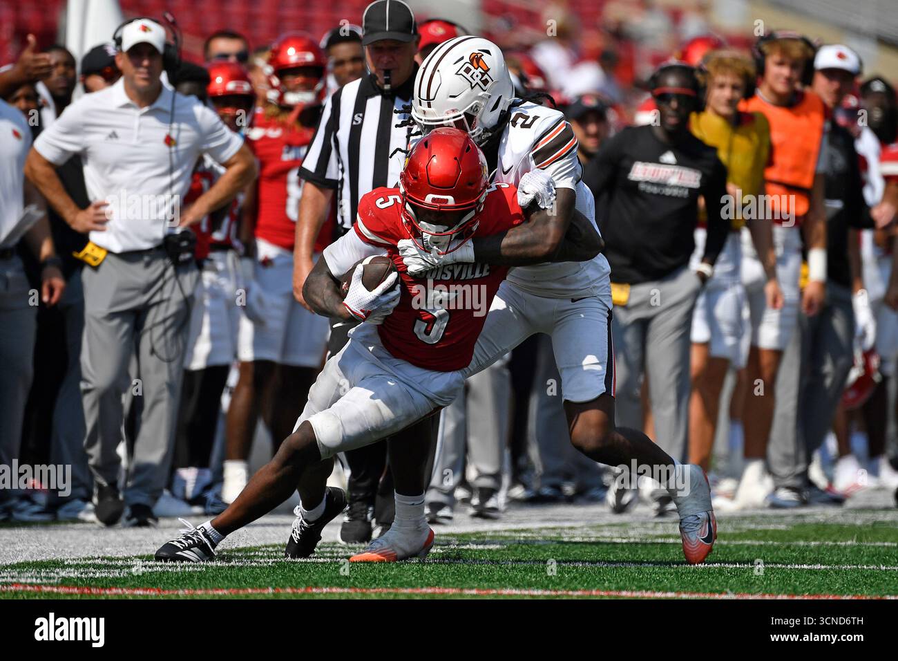 Louisville wide receiver Caullin Lacy (5) is grabbed by Bowling Green ...