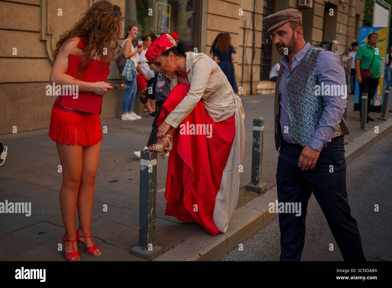 An artist of the Bucharest Metropolitan Circus adjusts her shoe during ...