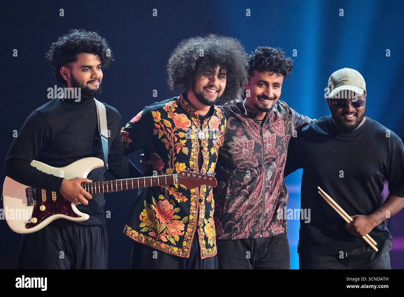 India's Rauhan Malik, 2nd left, performs the song "Love" at the ...
