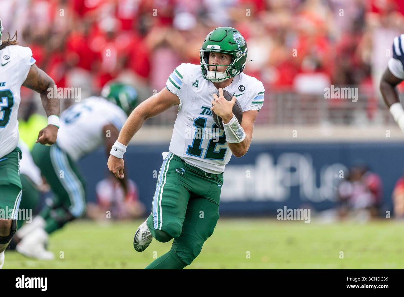 Tulane quarterback Cade Scott (12) runs the ball against Mississippi ...