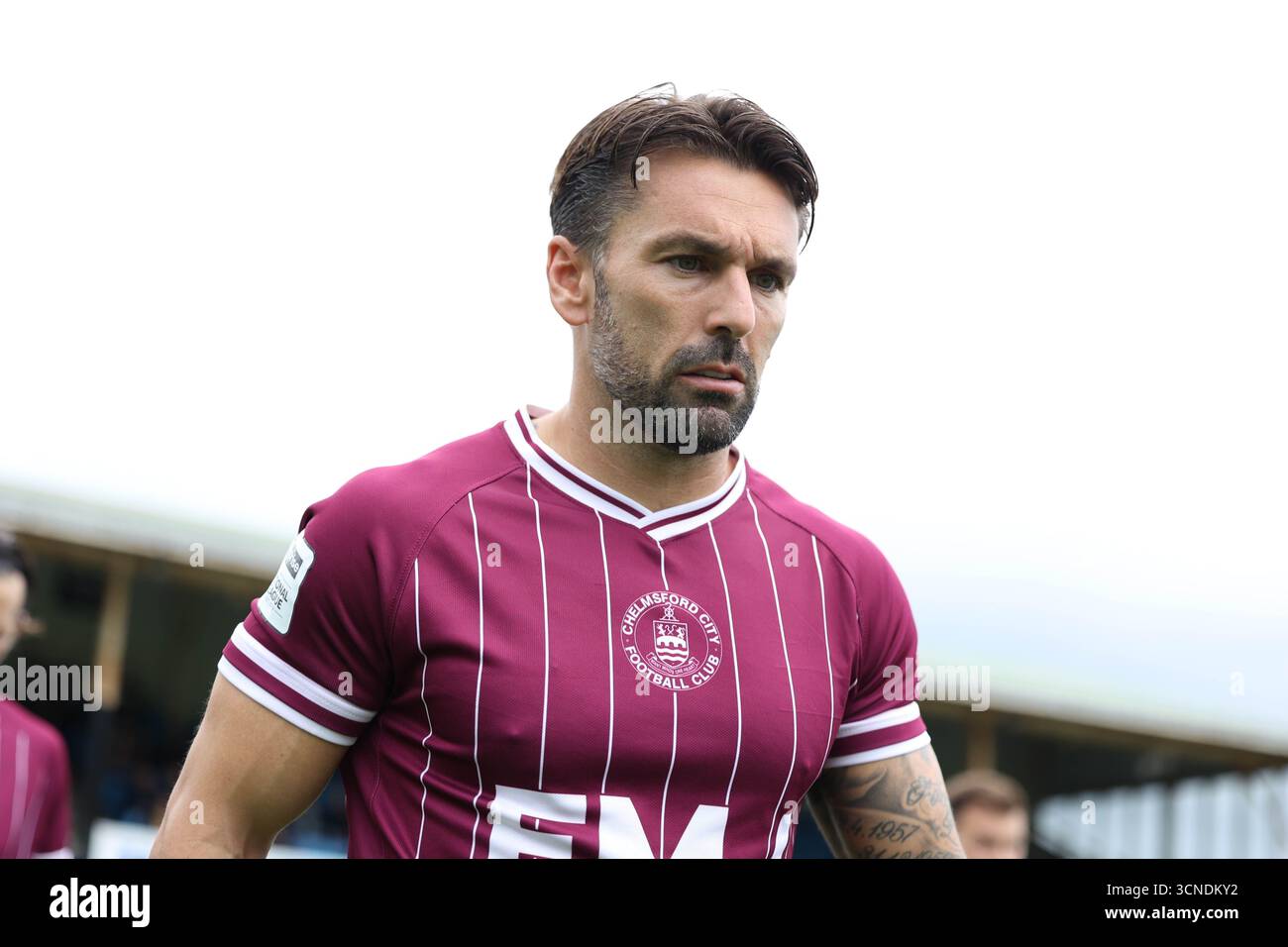 Ricky Holmes, of Chelmsford City, walking into the pitch for the match ...