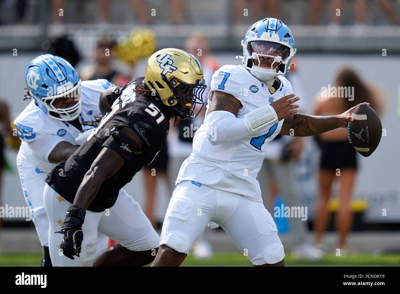 North Carolina quarterback Gio Lopez (7) throws a pass as he is ...