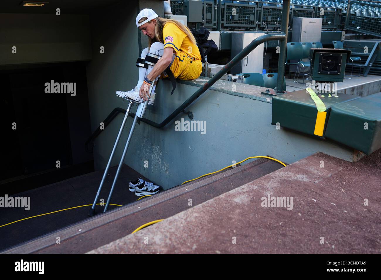 Savannah Bananas' Dakota "Stilts" Albritton adjusts his stilts before a ...