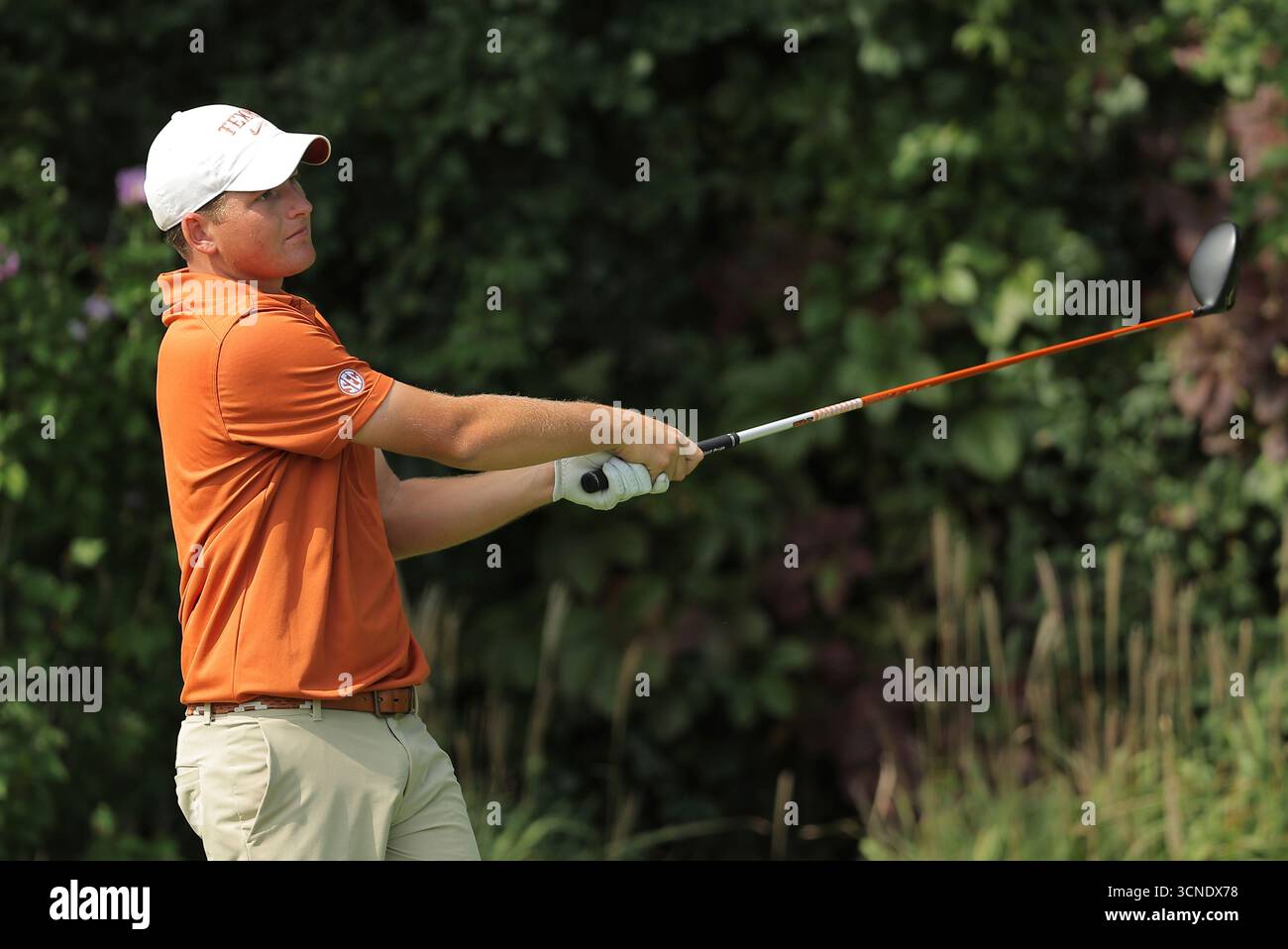 Daniel Bennett, of Texas, watches his shot from hole one during an NCAA ...
