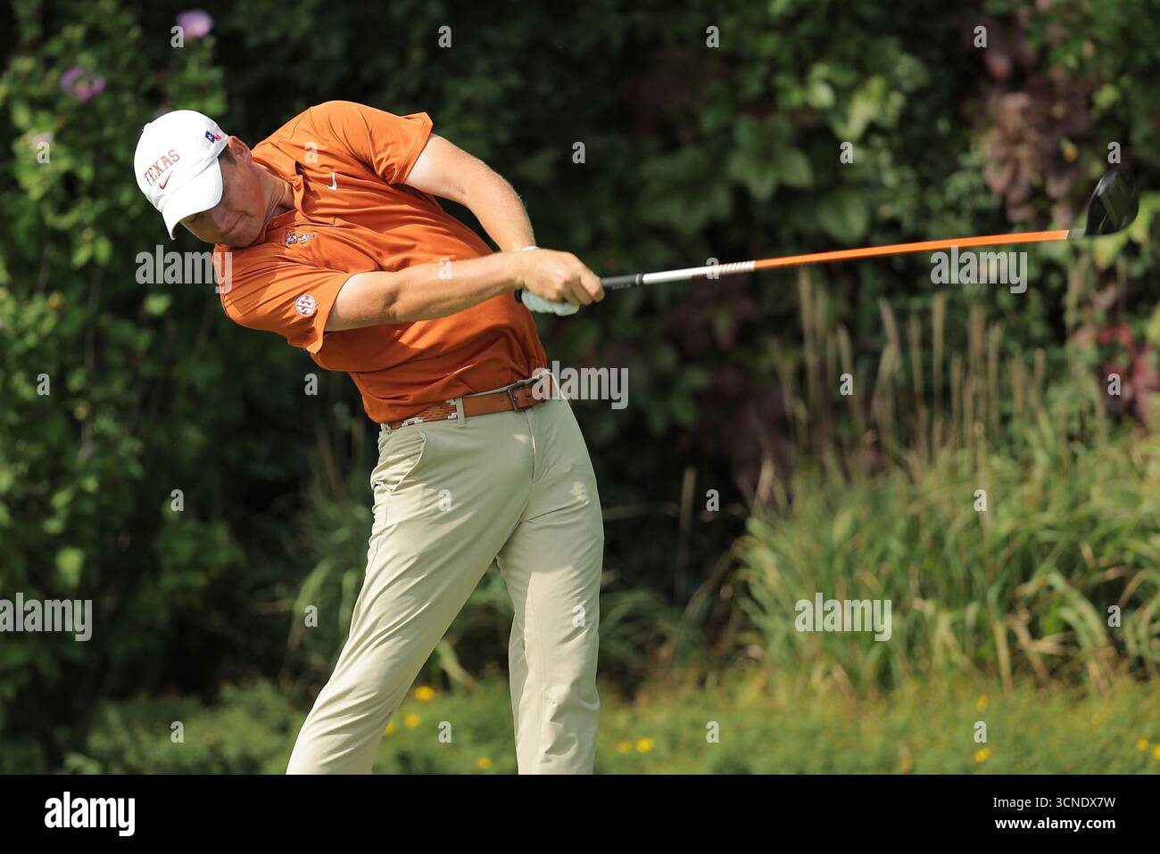 Daniel Bennett, of Texas, tees off from hole one during an NCAA golf ...