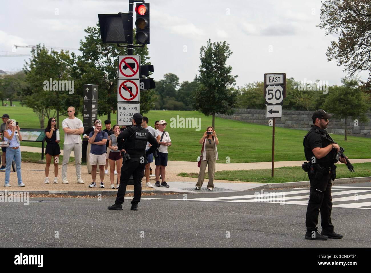 Secret Service police officers block off the intersection as President ...