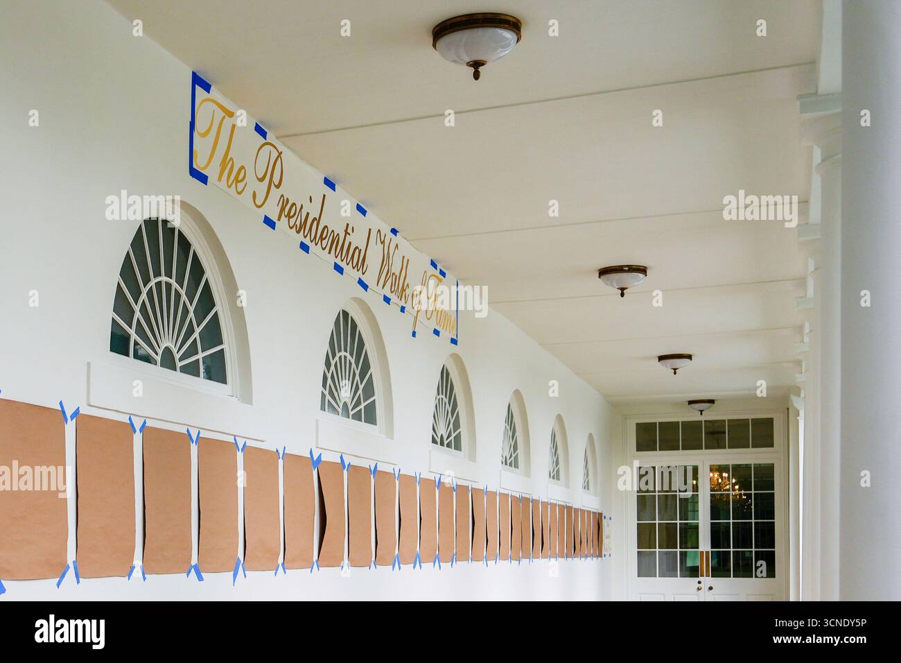The words "The Presidential Walk of Fame" and pieces of brown paper are ...