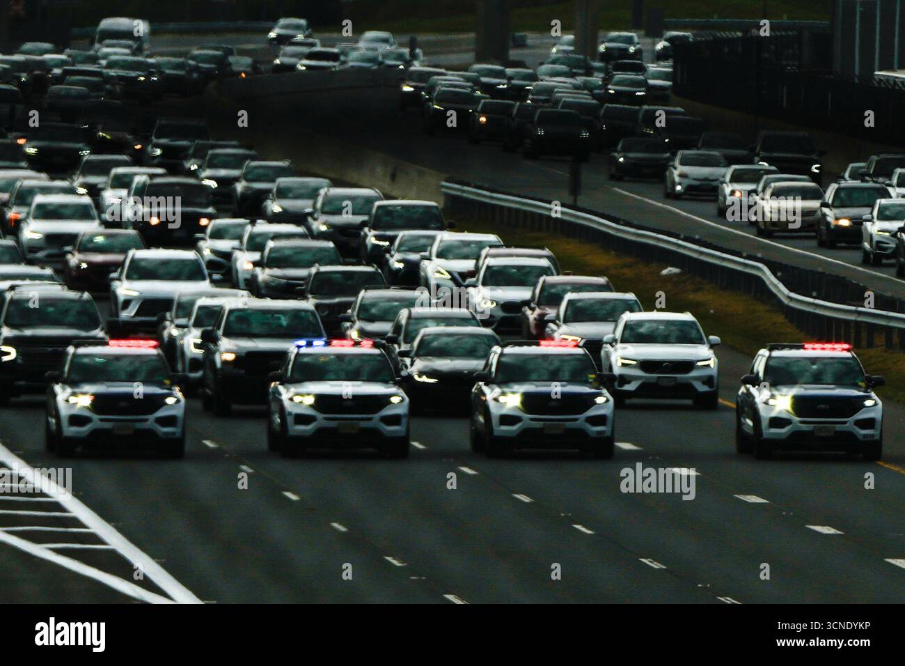 Police cars block off a highway as President Donald Trump's motorcade ...