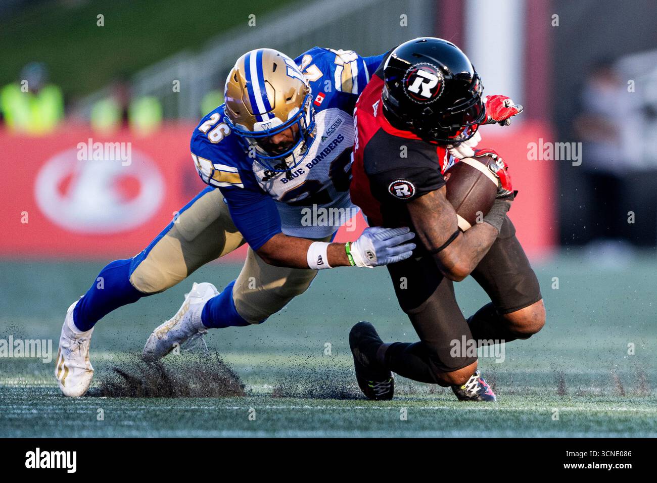 Winnipeg Blue Bombers defensive back Jaiden Woodbey (26) tackles Ottawa Redblacks wide receiver ...