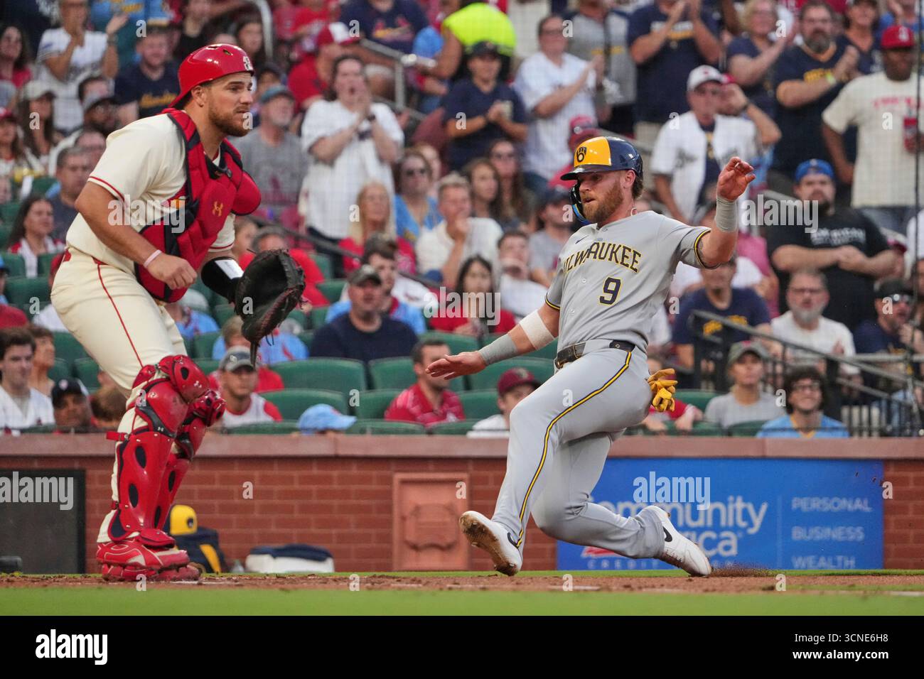 Milwaukee Brewers' Jake Bauers (9) scores past St. Louis Cardinals ...