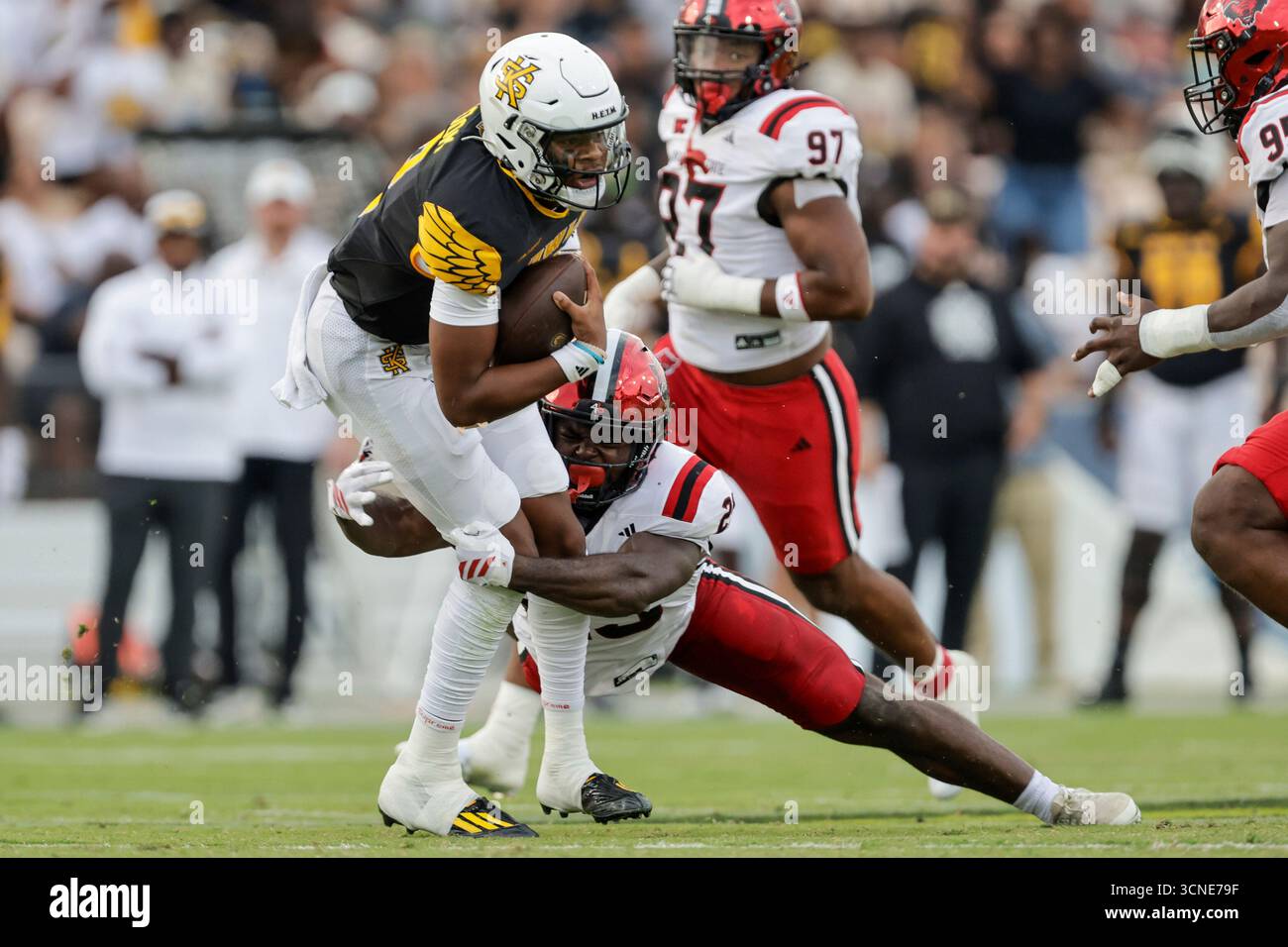 Kennesaw State quarterback Amari Odom (2) is tackled by Arkansas State ...