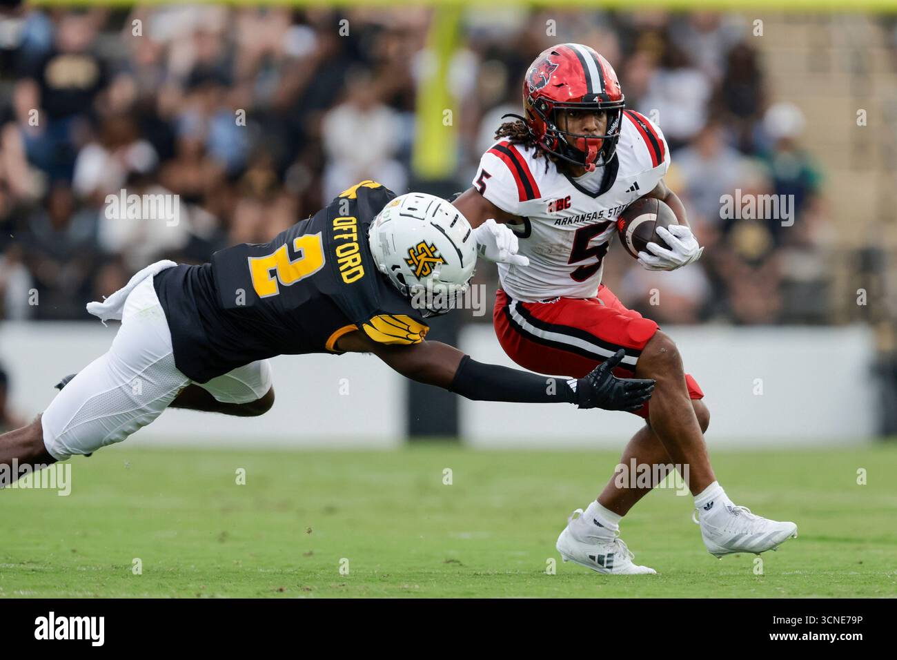 Arkansas State running back Kenyon Clay (5) is tackled by Kennesaw ...