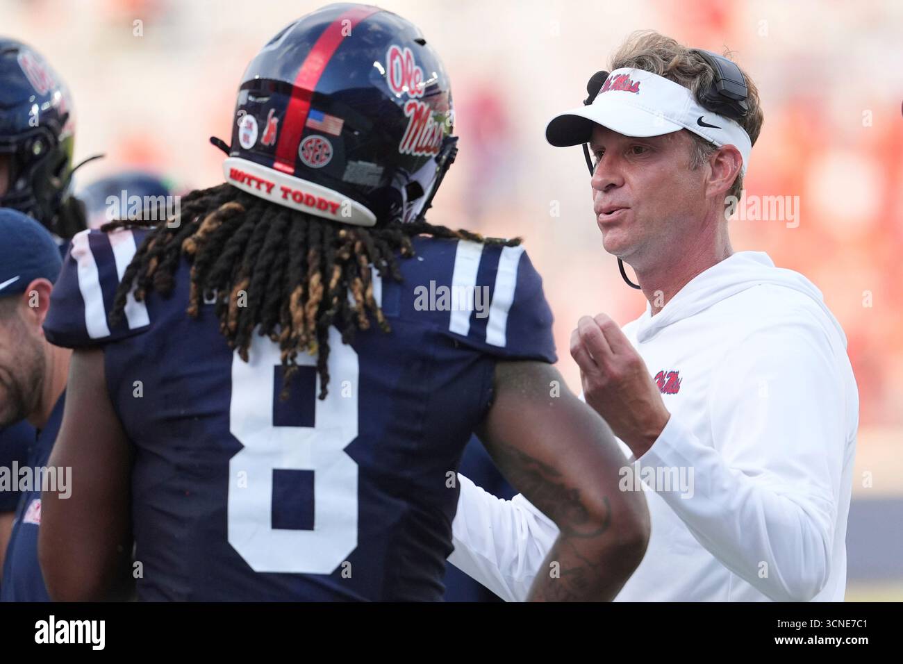 Mississippi head coach Lane Kiffin confers with tight end Dae'Quan ...
