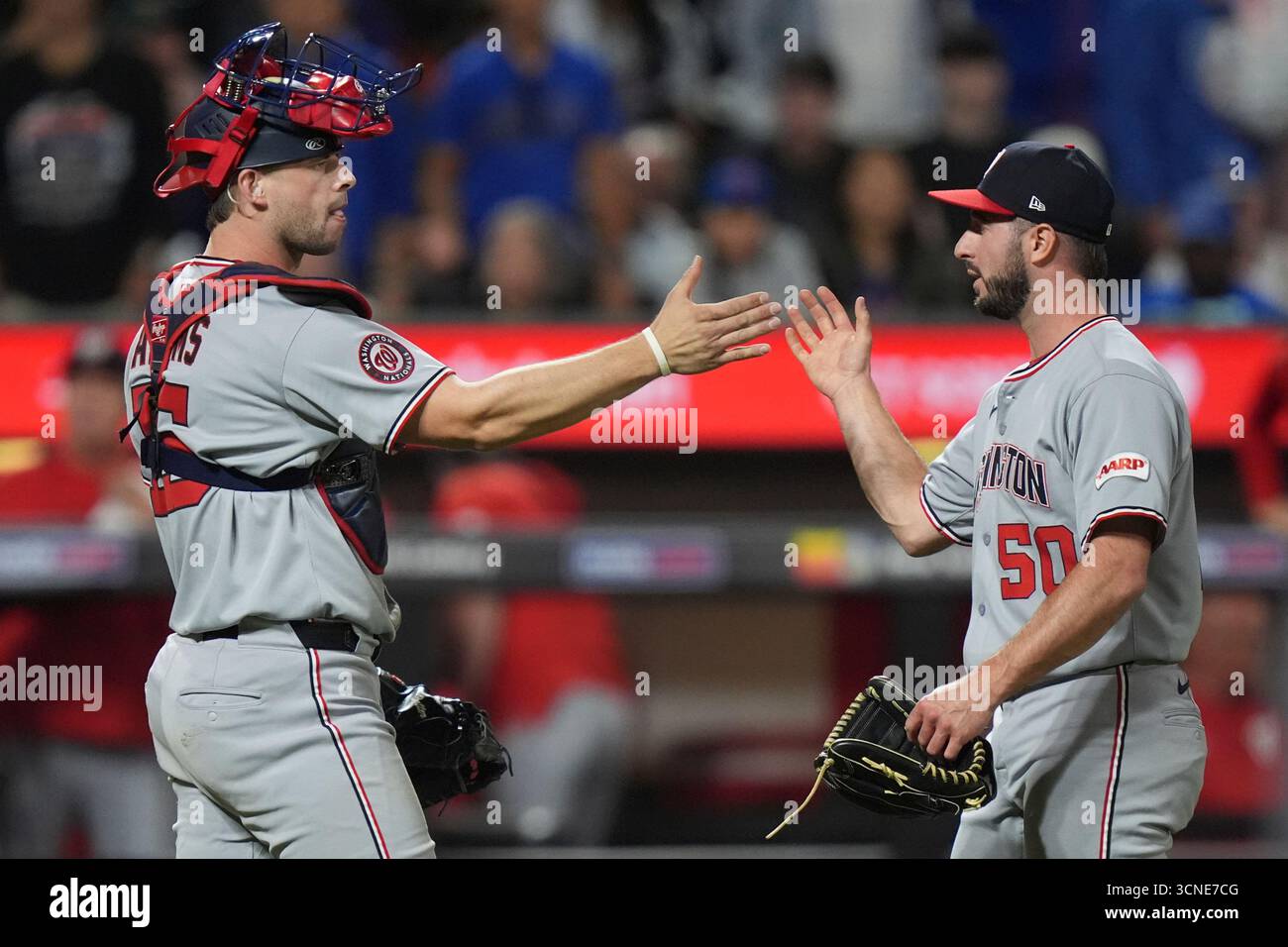 Washington Nationals pitcher PJ Poulin (50) celebrates with catcher ...