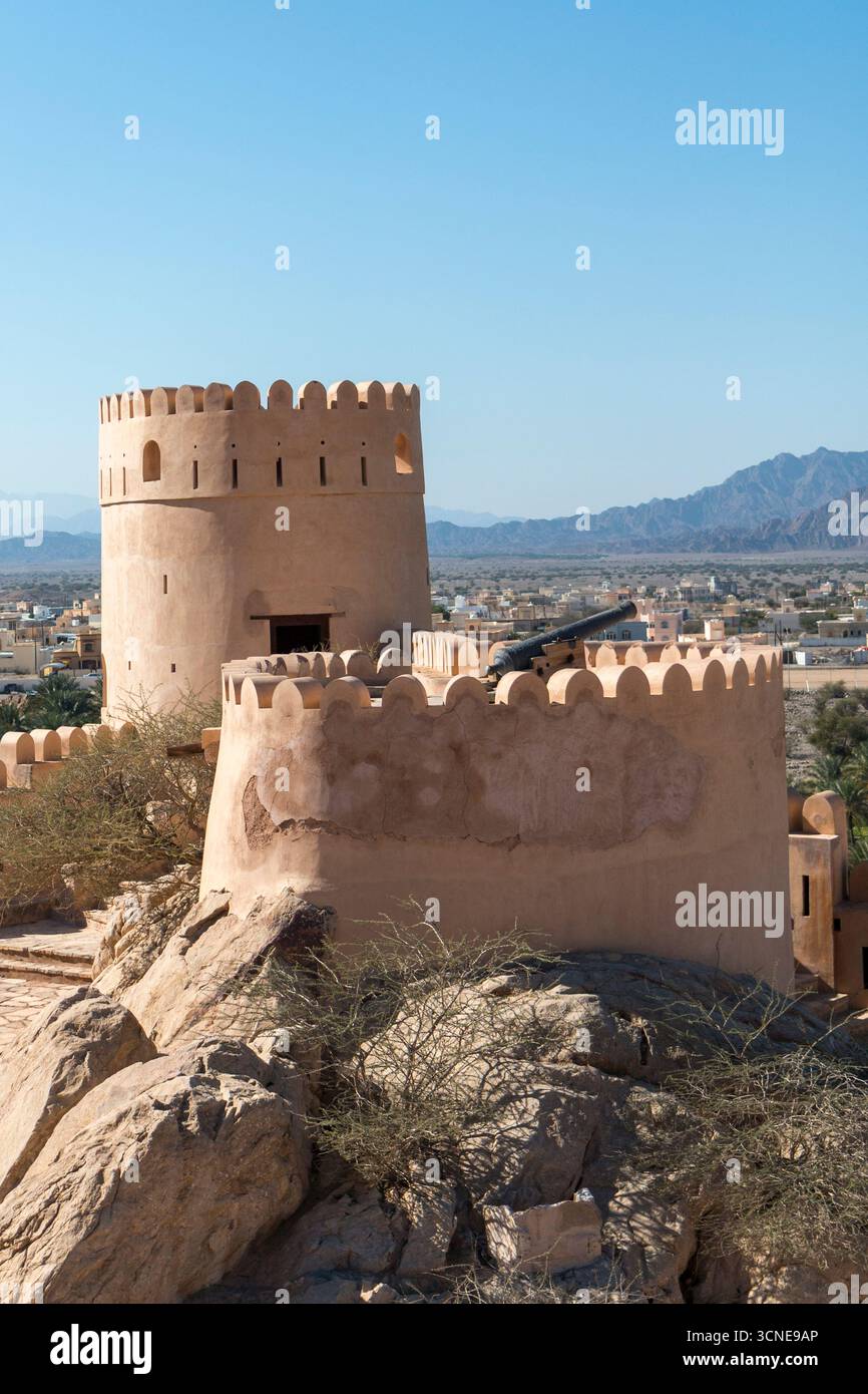 Oman - Nakhal - Nakhal Fort - Round tower with cannon surveys the oasis ...