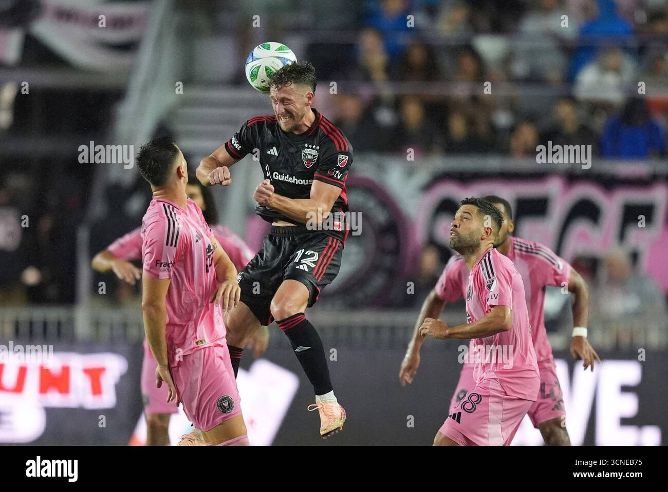 D.C. United defender Conner Antley (12) heads the ball over Inter Miami ...
