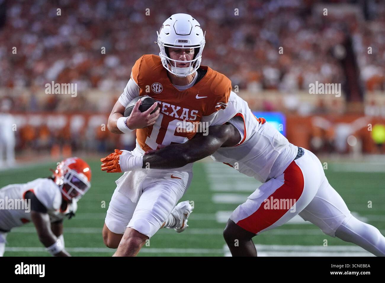 Texas quarterback Arch Manning (16) is hit by Sam Houston State ...