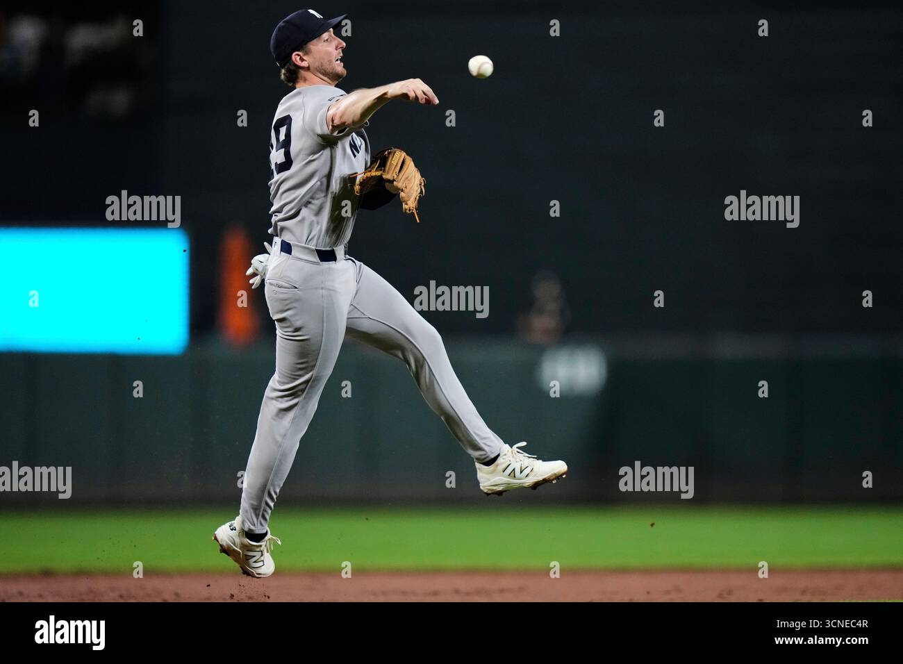 New York Yankees third baseman Ryan McMahon throws to first base to put ...