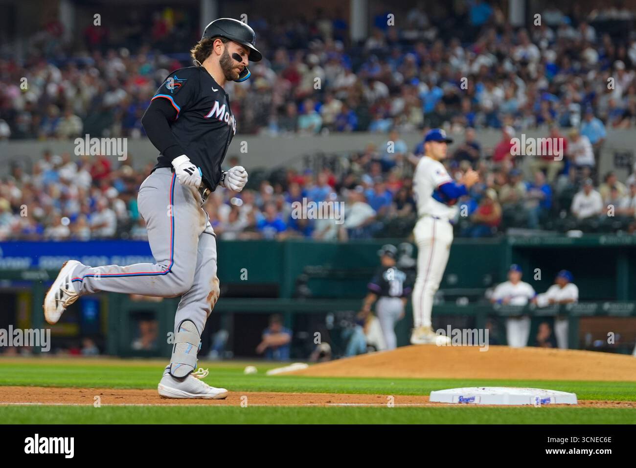 Miami Marlins' Connor Norby, left, runs the bases after hitting a solo ...