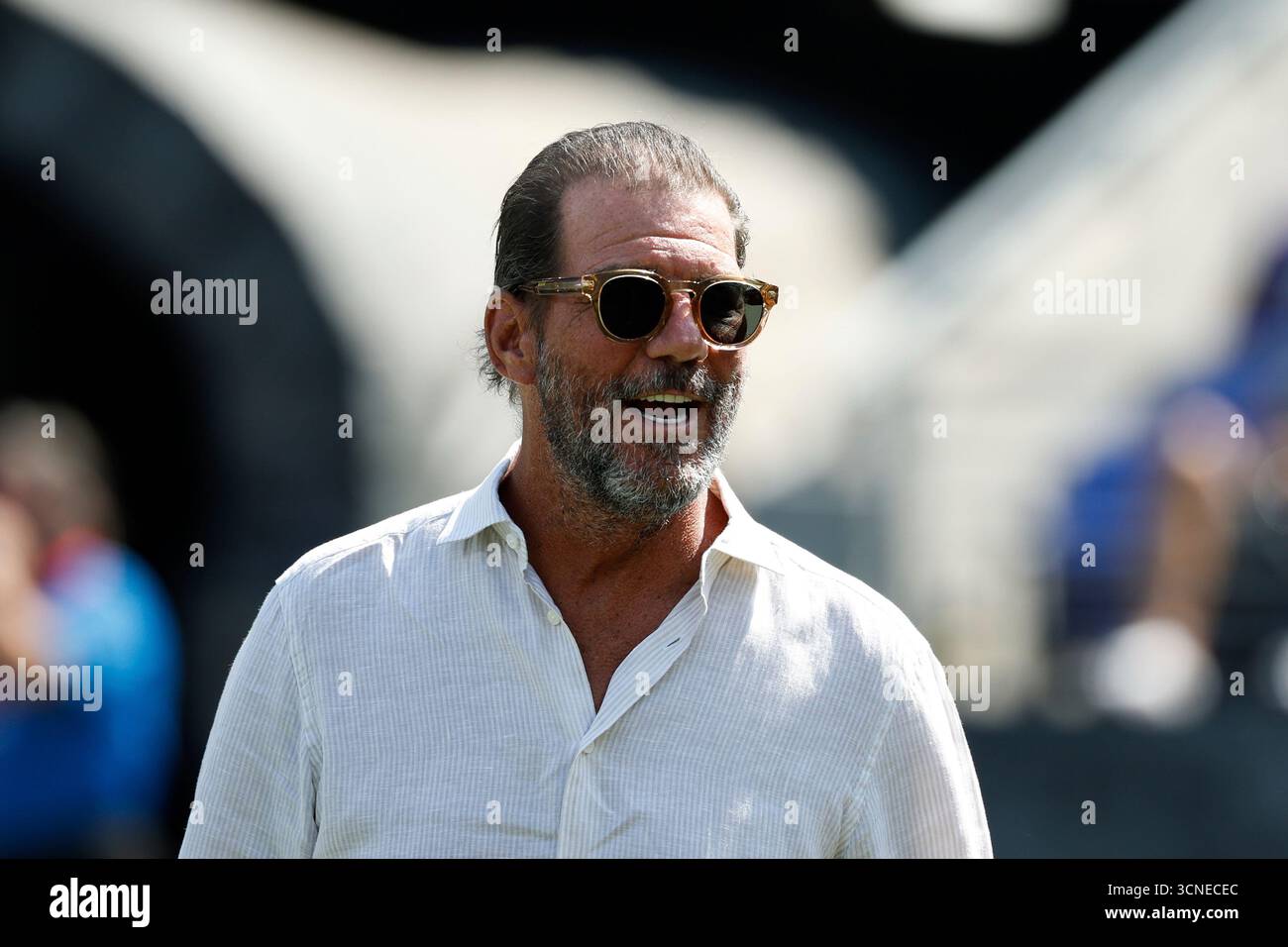 Baltimore Ravens owner Steve Bisciotti walks on the field before an NFL ...