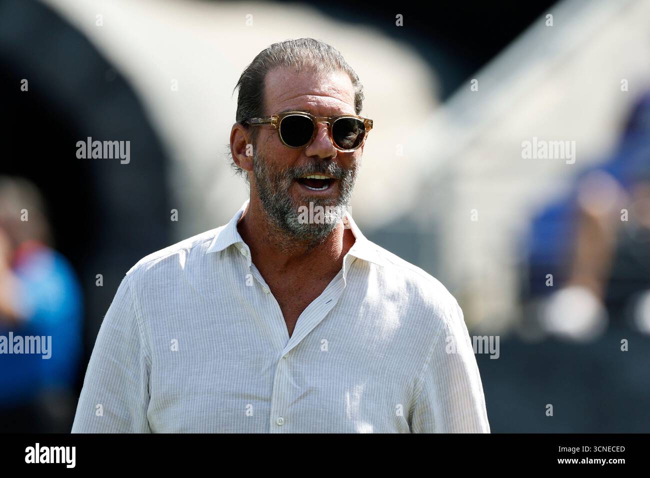 Baltimore Ravens owner Steve Bisciotti walks on the field before an NFL ...