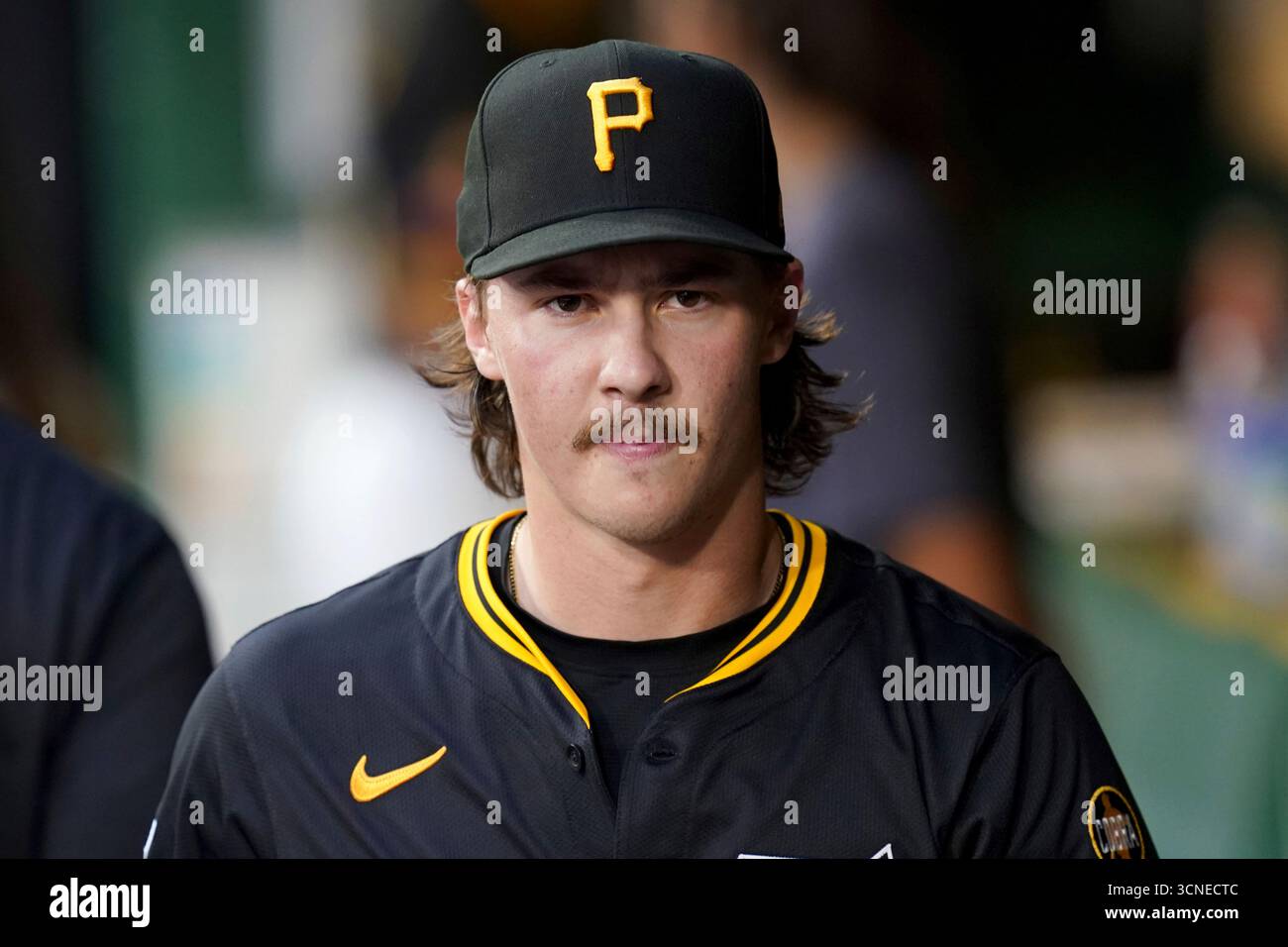 Pittsburgh Pirates pitcher Bubba Chandler stands in the dugout before a ...