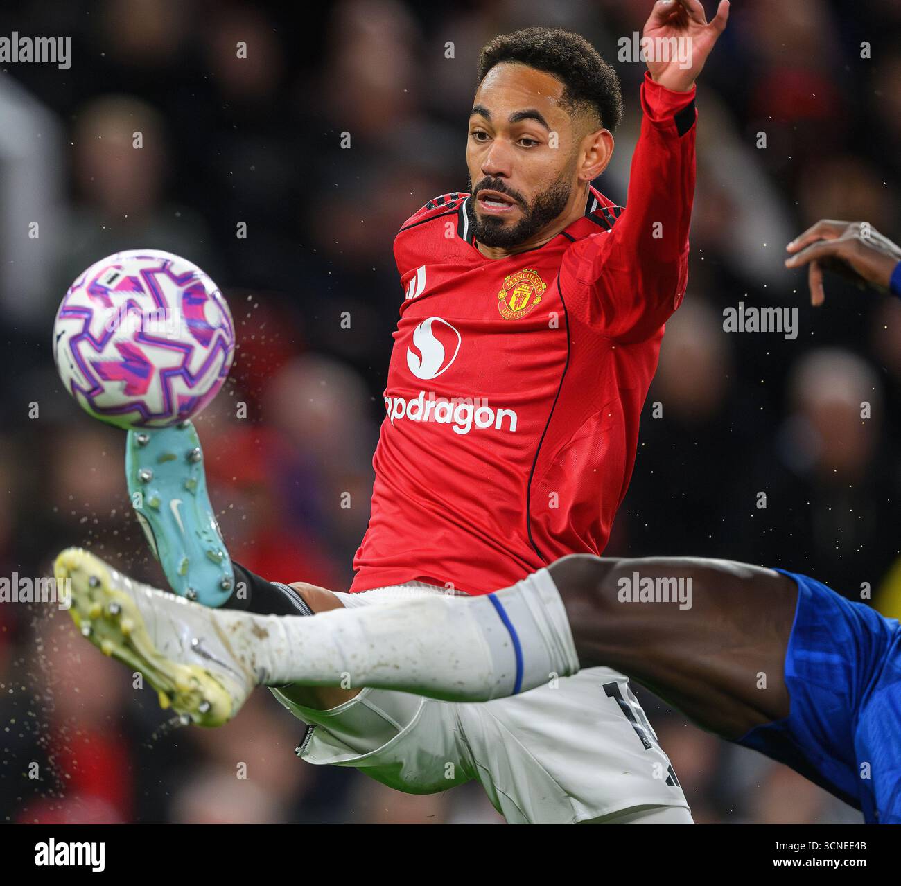 Manchester United v Chelsea - Premier League - Old Trafford. Matheus Cunha battles for the ball ...