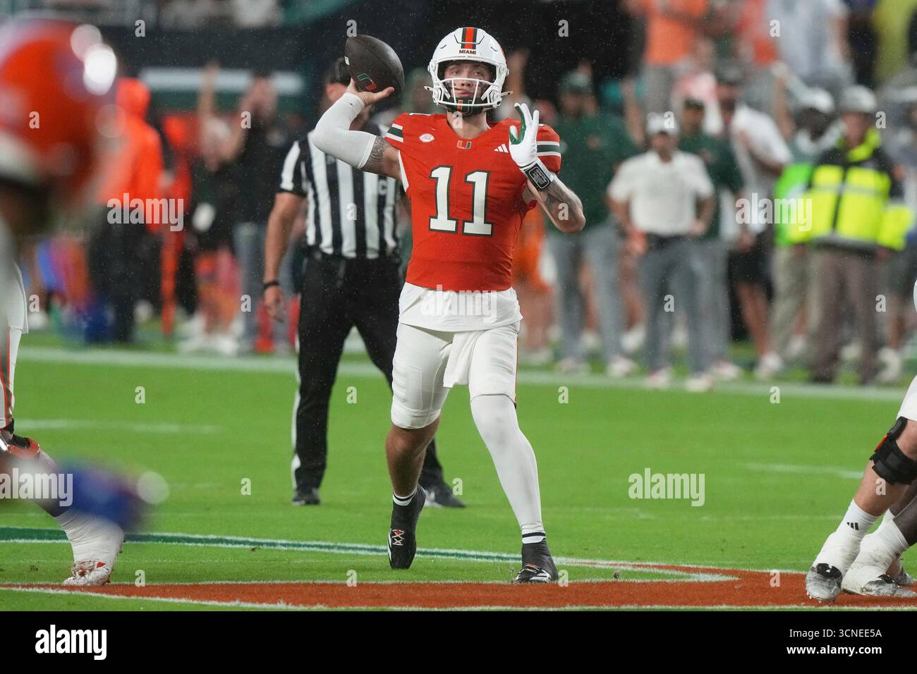 Miami quarterback Carson Beck (11) aims a pass during the first half of ...