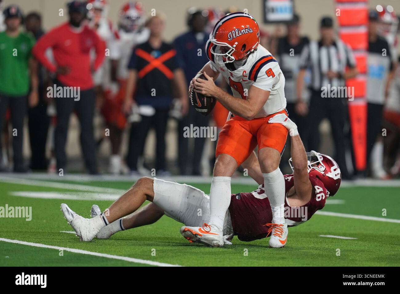 Illinois quarterback Luke Altmyer (9) is sacked bye Indiana linebacker ...