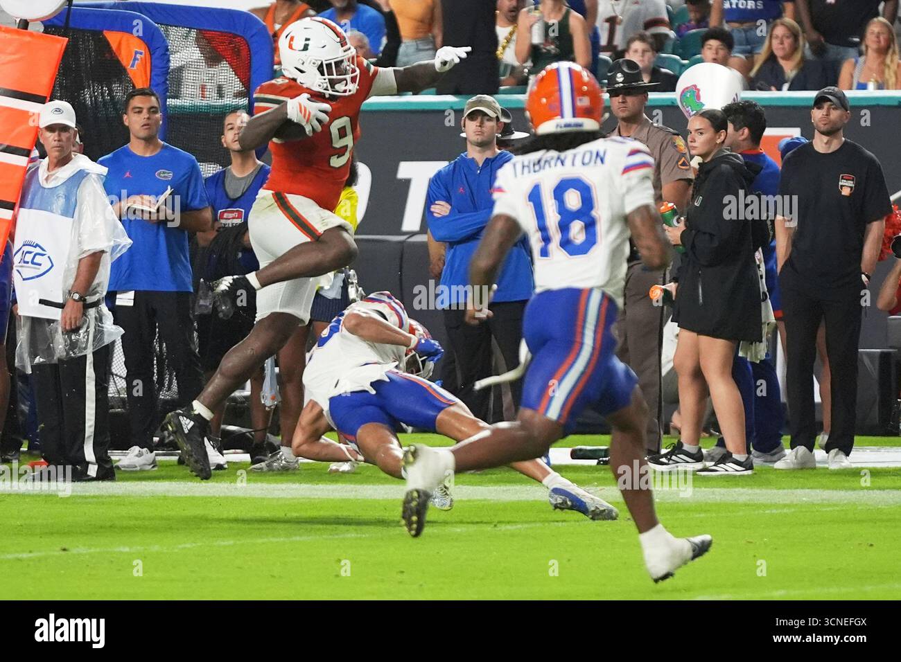 Miami tight end Elija Lofton (9) runs for a first down during the first ...