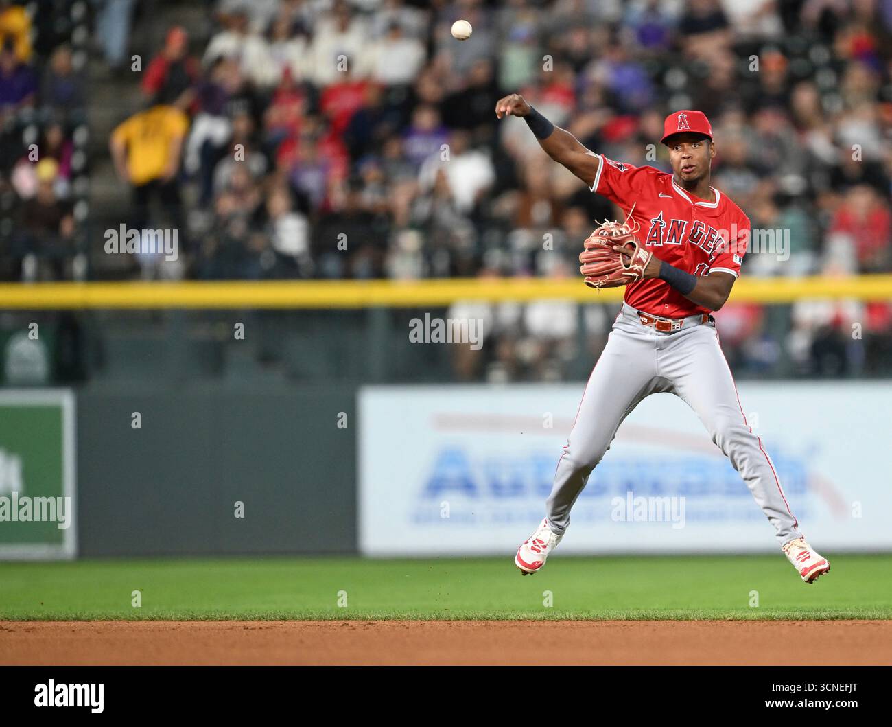 Los Angeles Angels shortstop Denzer Guzman throws to first base but can ...