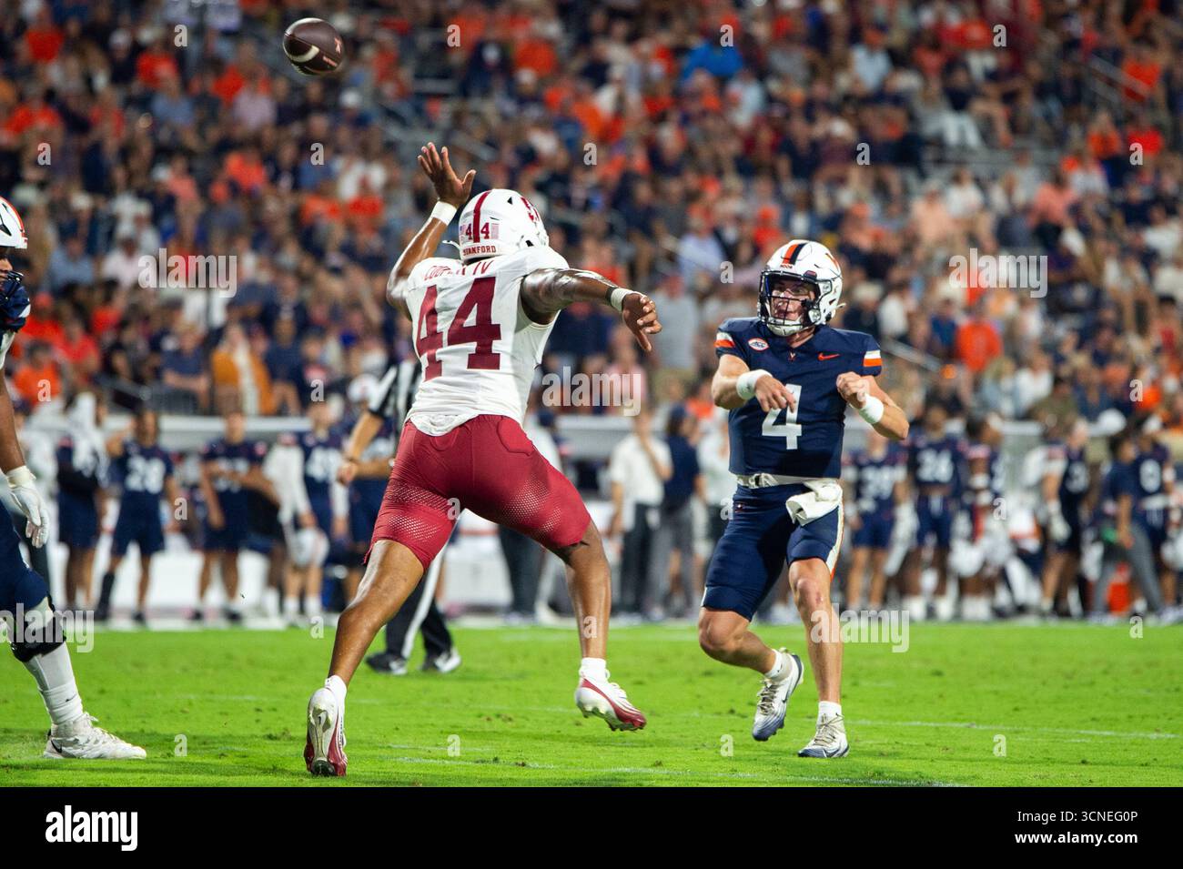 Virginia quarterback Chandler Morris (4) gets rid of pass as he's ...