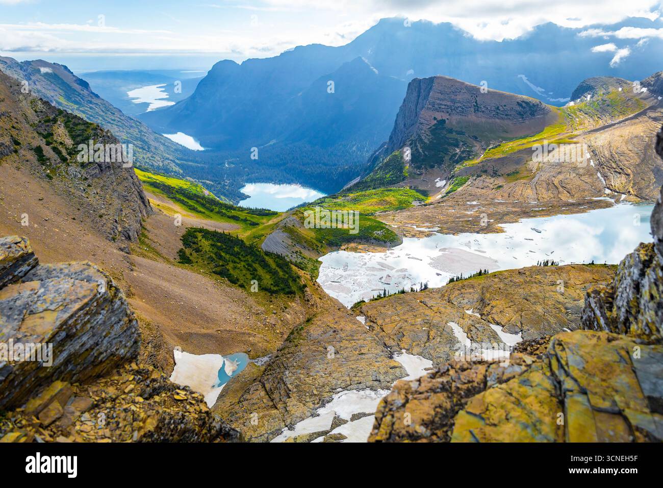 A breathtaking view captures Grinnell Glacier and Upper Grinnell Lake ...