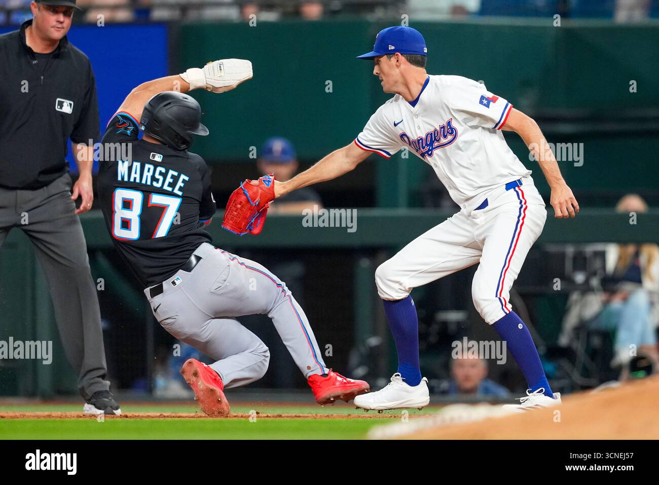 Texas Rangers pitcher Hoby Milner, right, tags out Miami Marlins' Jakob ...