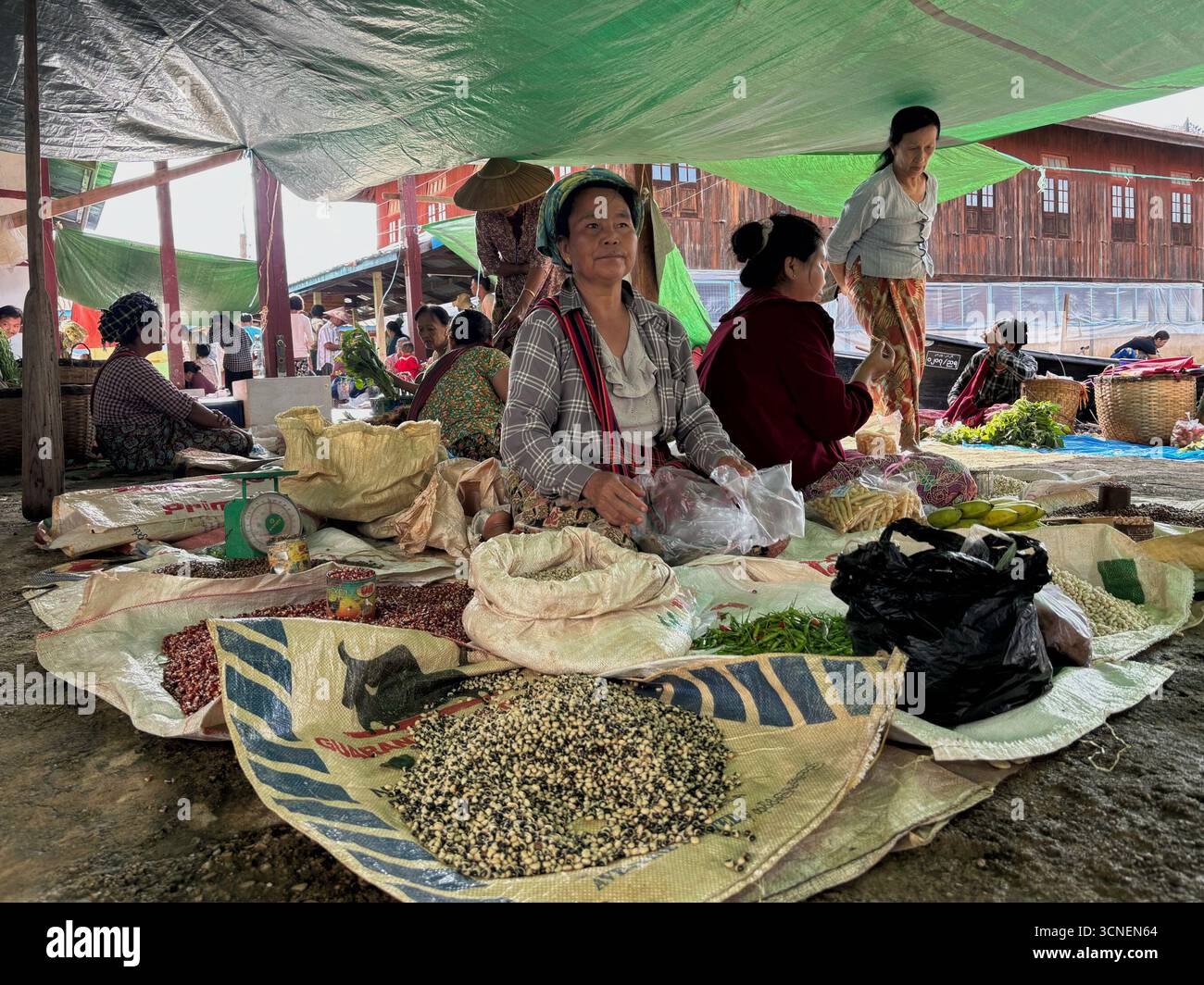 Ethnic Pa-O vendors wait for customers at a local bazaar Sunday, Sept ...