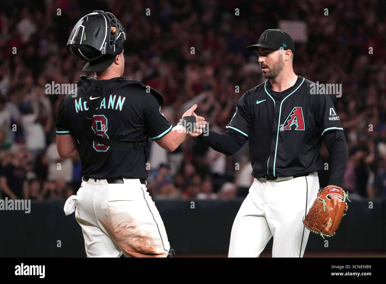 Arizona Diamondbacks catcher James McCann (8) and pitcher John Curtiss ...