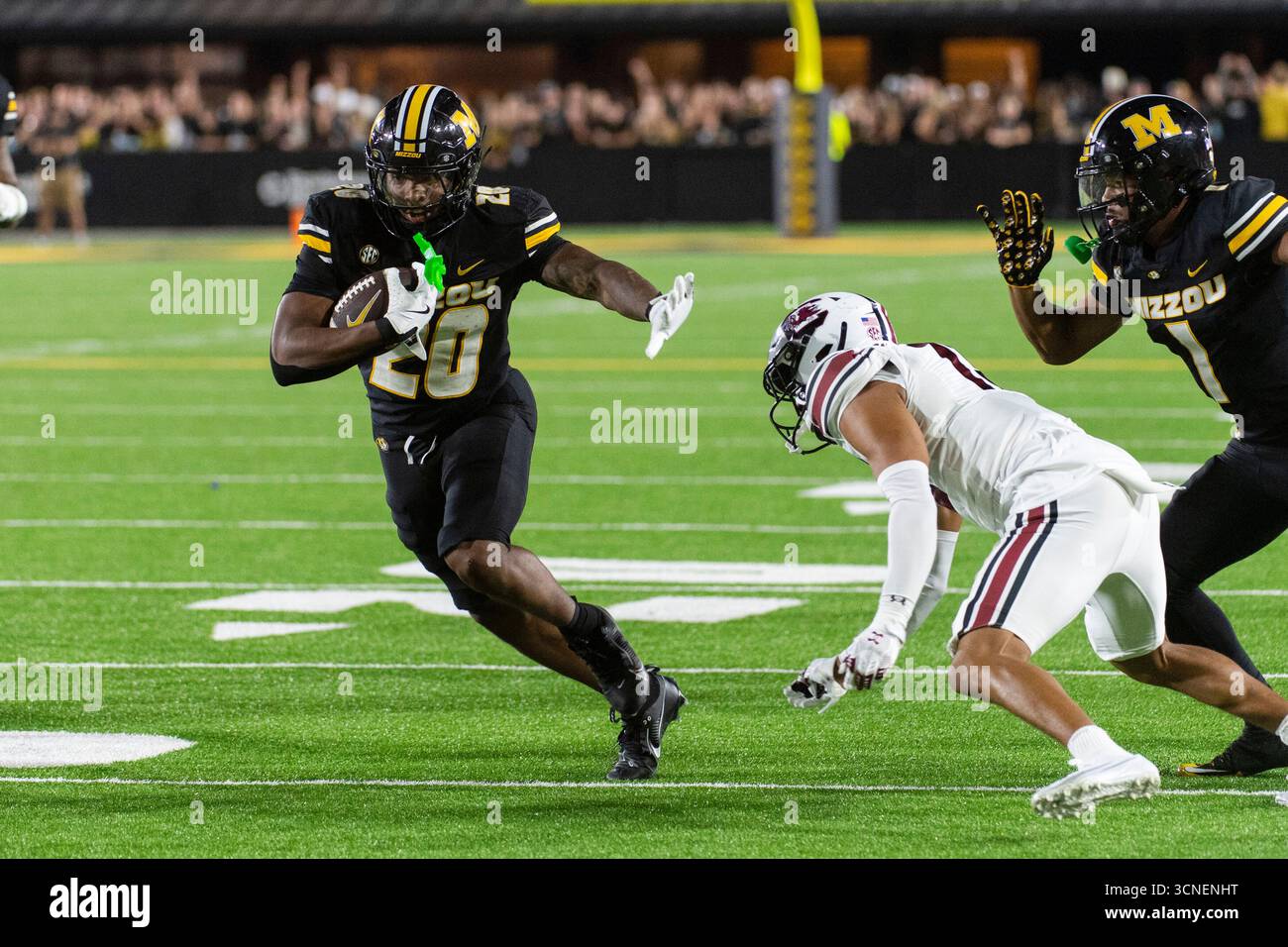Missouri running back Jamal Roberts, left, runs past South Carolina ...