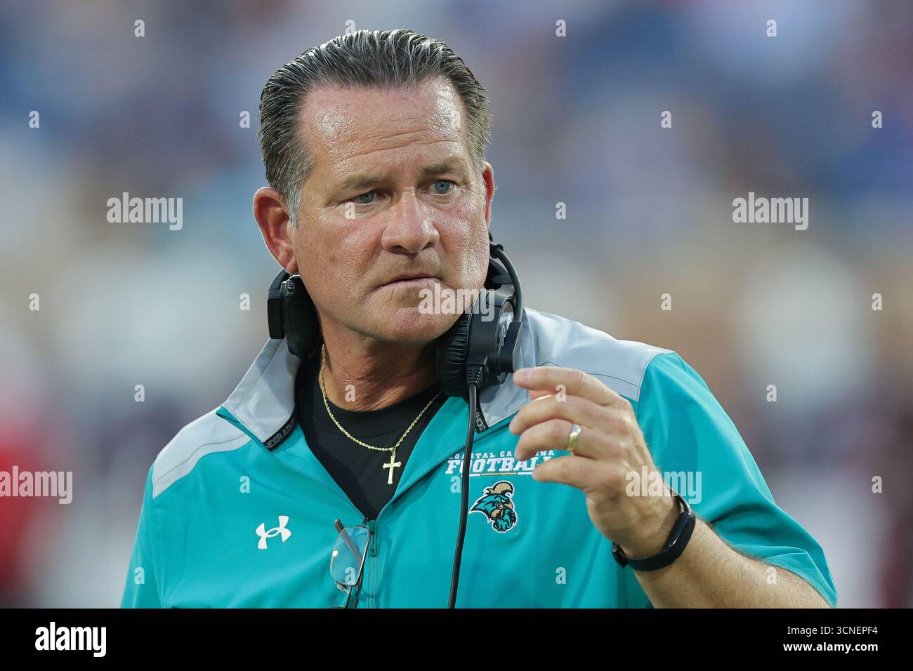 Sep 20, 2025: Coastal Carolina Chanticleers head coach Tim Beck watches ...