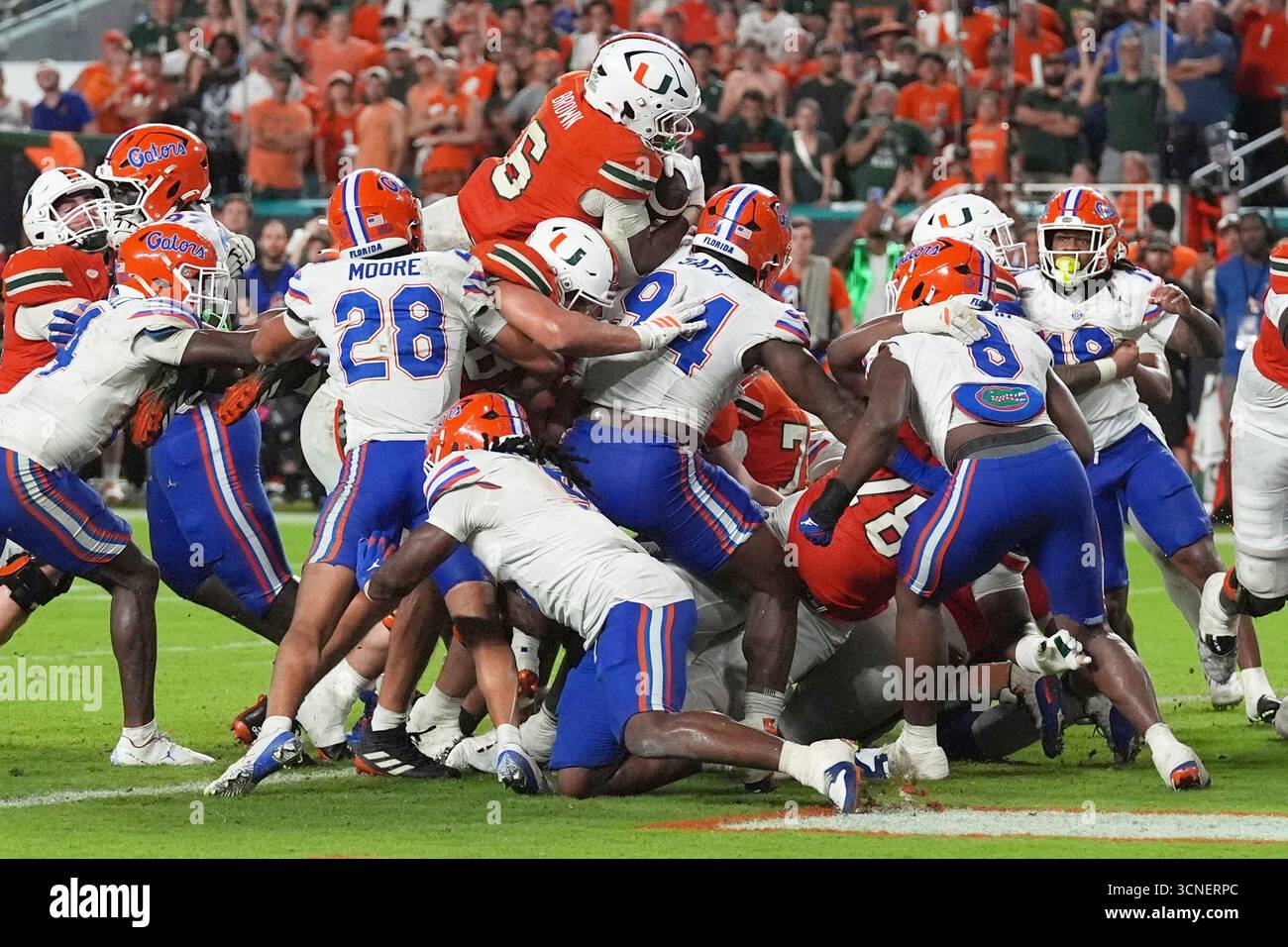 Miami running back CharMar Brown (6) scores a touchdown during the ...