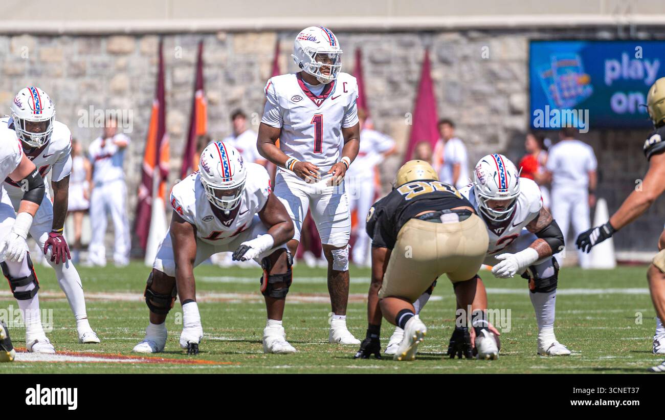 Virginia Tech quarterback Kyron Drones (1) looks over the defense ...