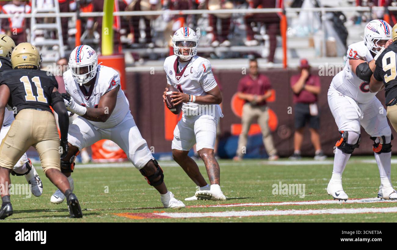 Virginia Tech quarterback Kyron Drones (1) looks to pass downfield ...