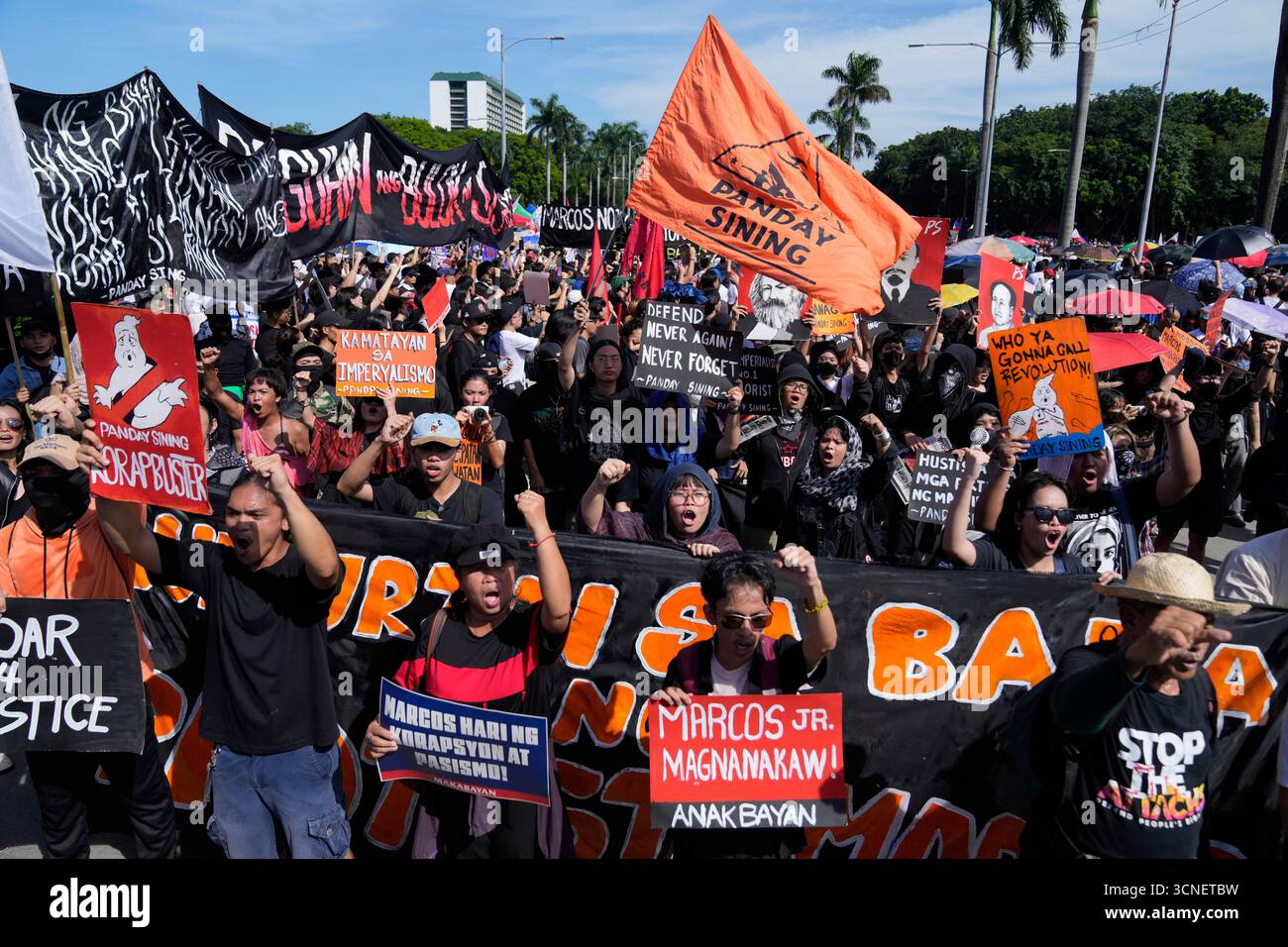 Demonstrators chant slogans during an anti-corruption rally at Manila ...