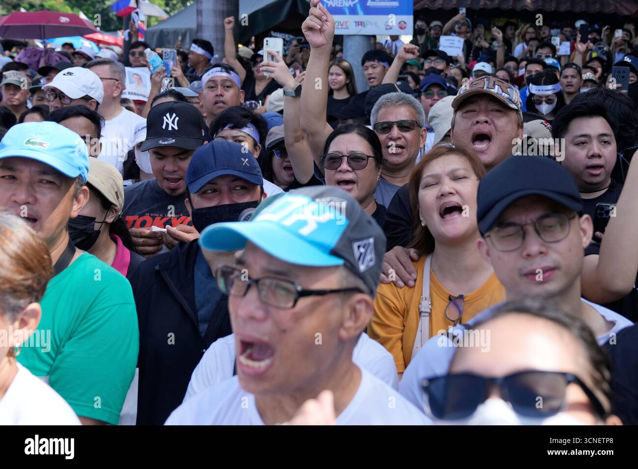 Protesters shout slogans during an anti-corruption rally at Manila's ...